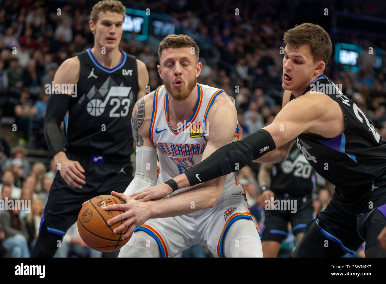 Utah Jazz forward Lauri Markkanen (23) looks on as Oklahoma City Thunder center Isaiah ...