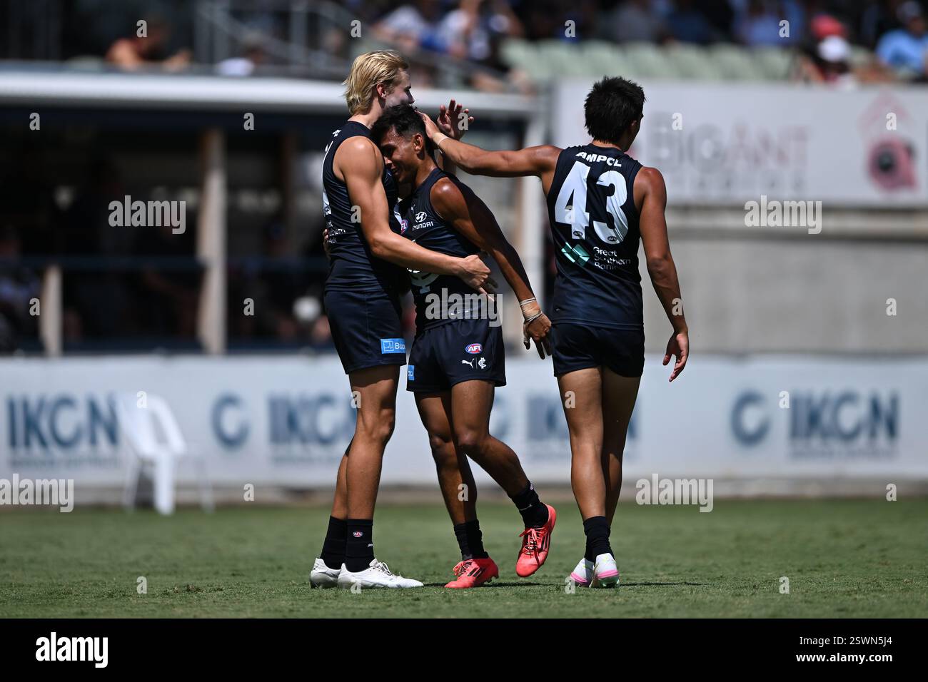 Jesse Motlop of Carlton (centre) celebrates with team mates after ...