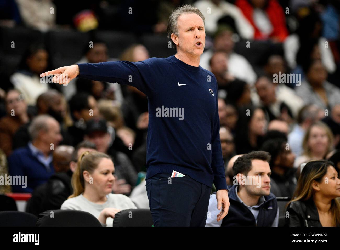 Washington Wizards head coach Brian Keefe points during the first half ...