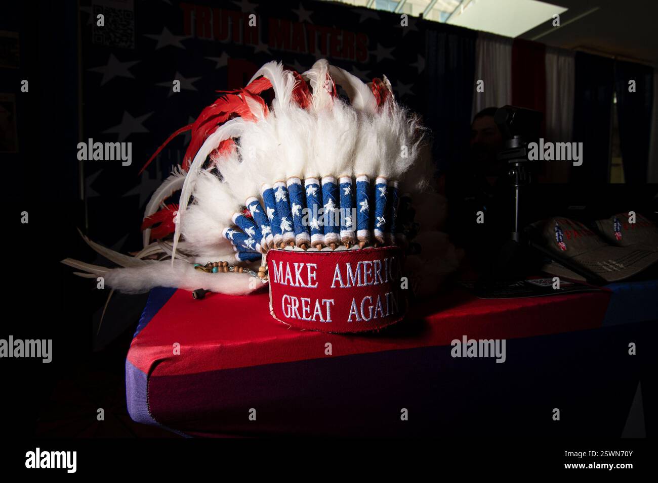 An attendee wears a MAGA headress to CPAC 25, in Washington DC, on ...