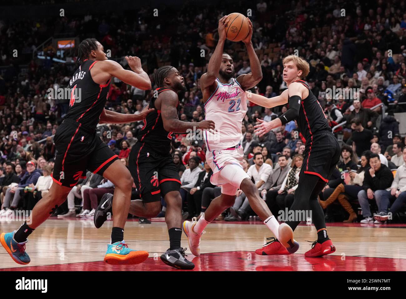 Miami Heat's Andrew Wiggins (22) drives to the net on Toronto Raptors ...
