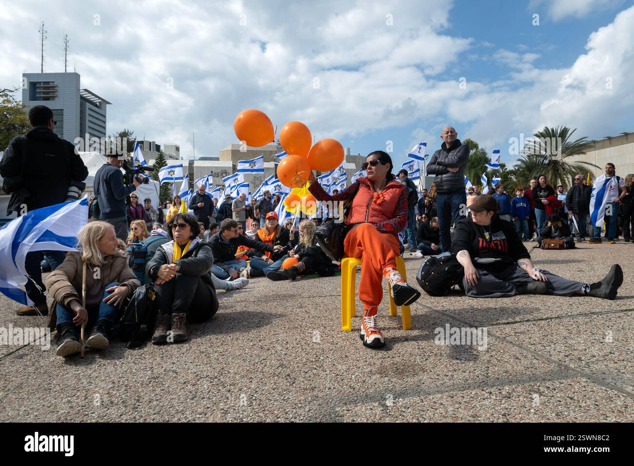 Tel Aviv, Israel. 20th Feb, 2025. Israeli citizens hold Israeli flags ...