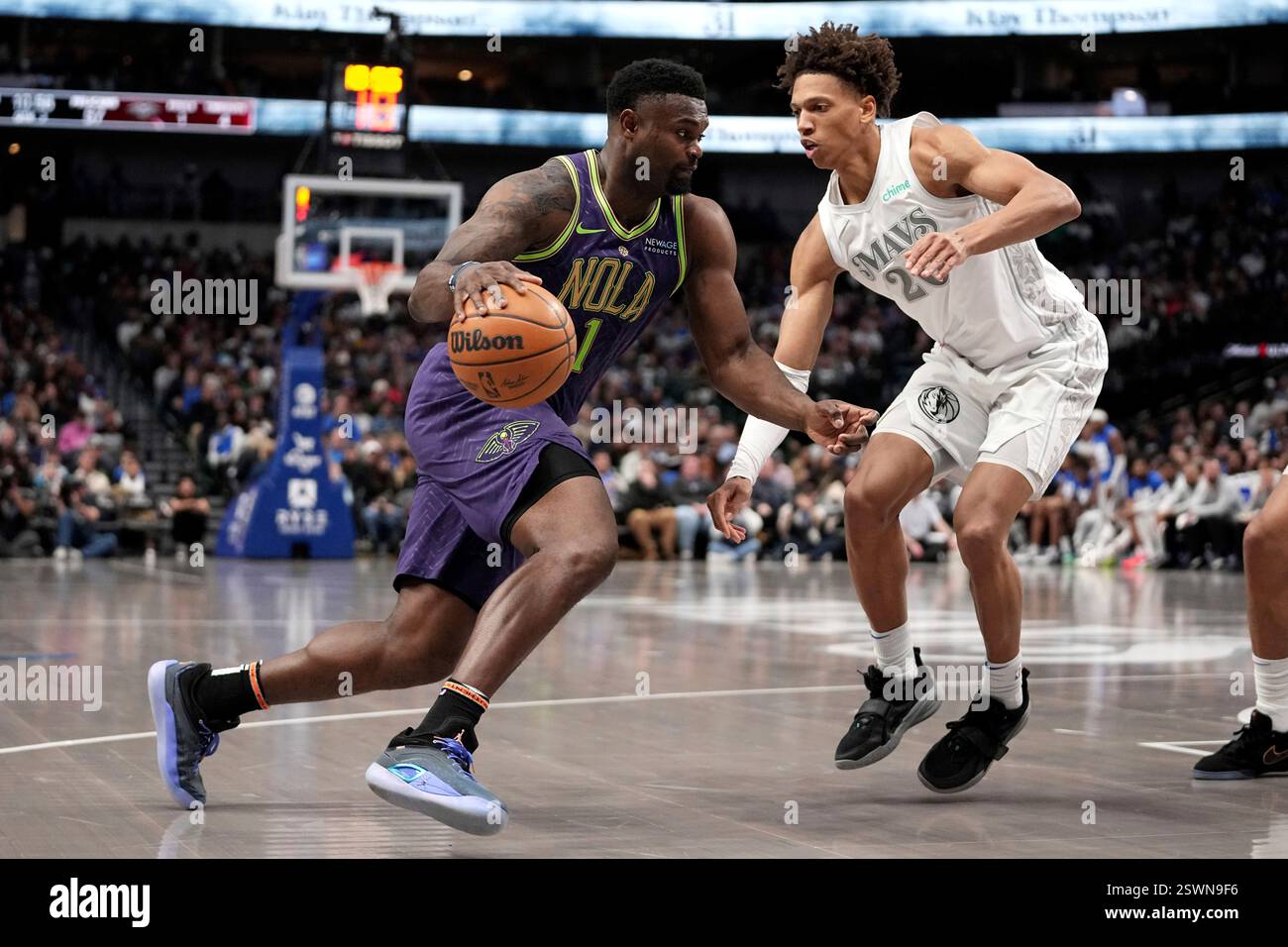 New Orleans Pelicans forward Zion Williamson, left, works to the basket ...