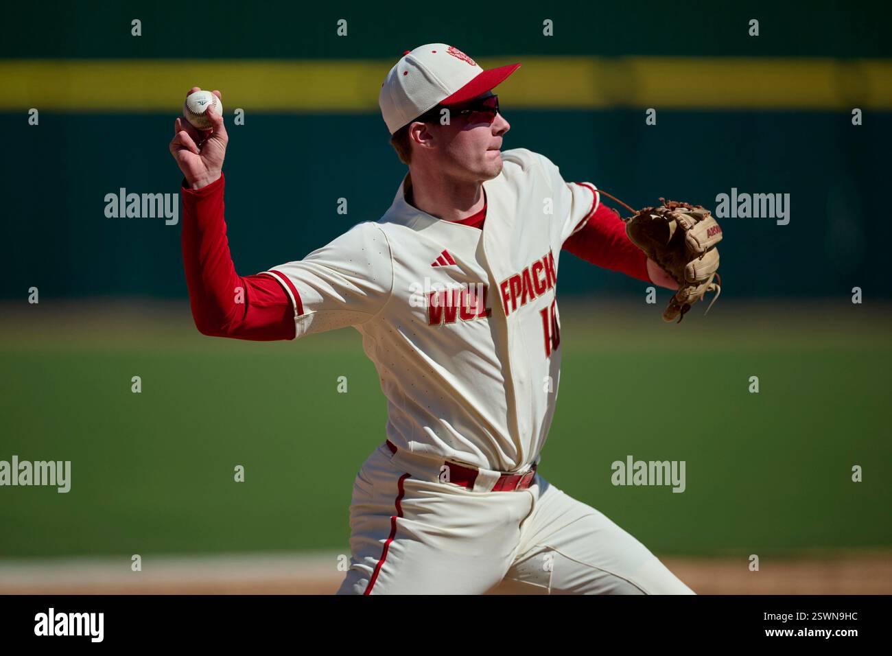 NC State Wolfpack third baseman Ryan Jaros (10) throws to first base during practice before an ...