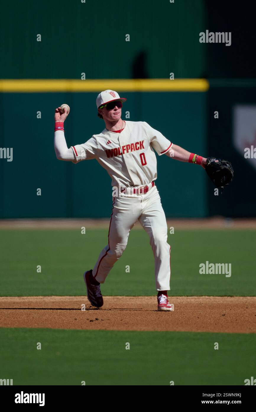 NC State Wolfpack second baseman Luke Nixon (0) throws to first base ...