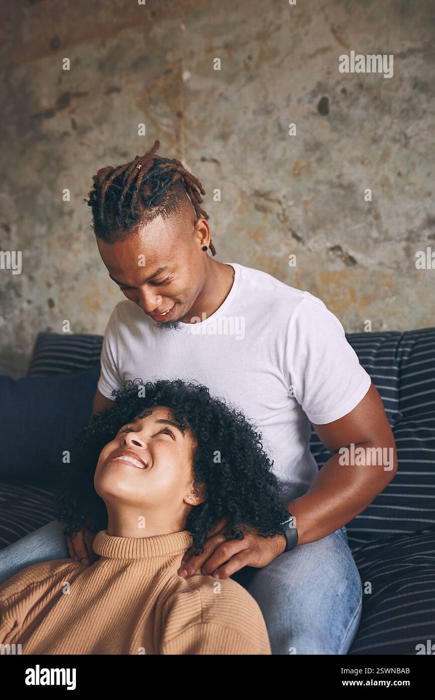 Smile, relax and shoulder massage with couple on sofa for bonding ...