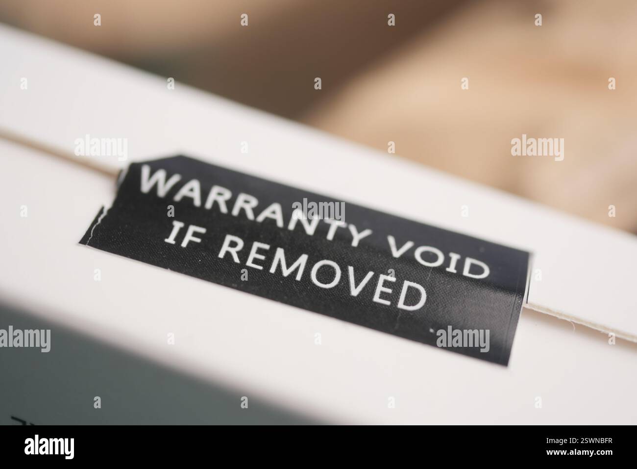 Warranty label indicating void status for removal of seal Stock Photo ...