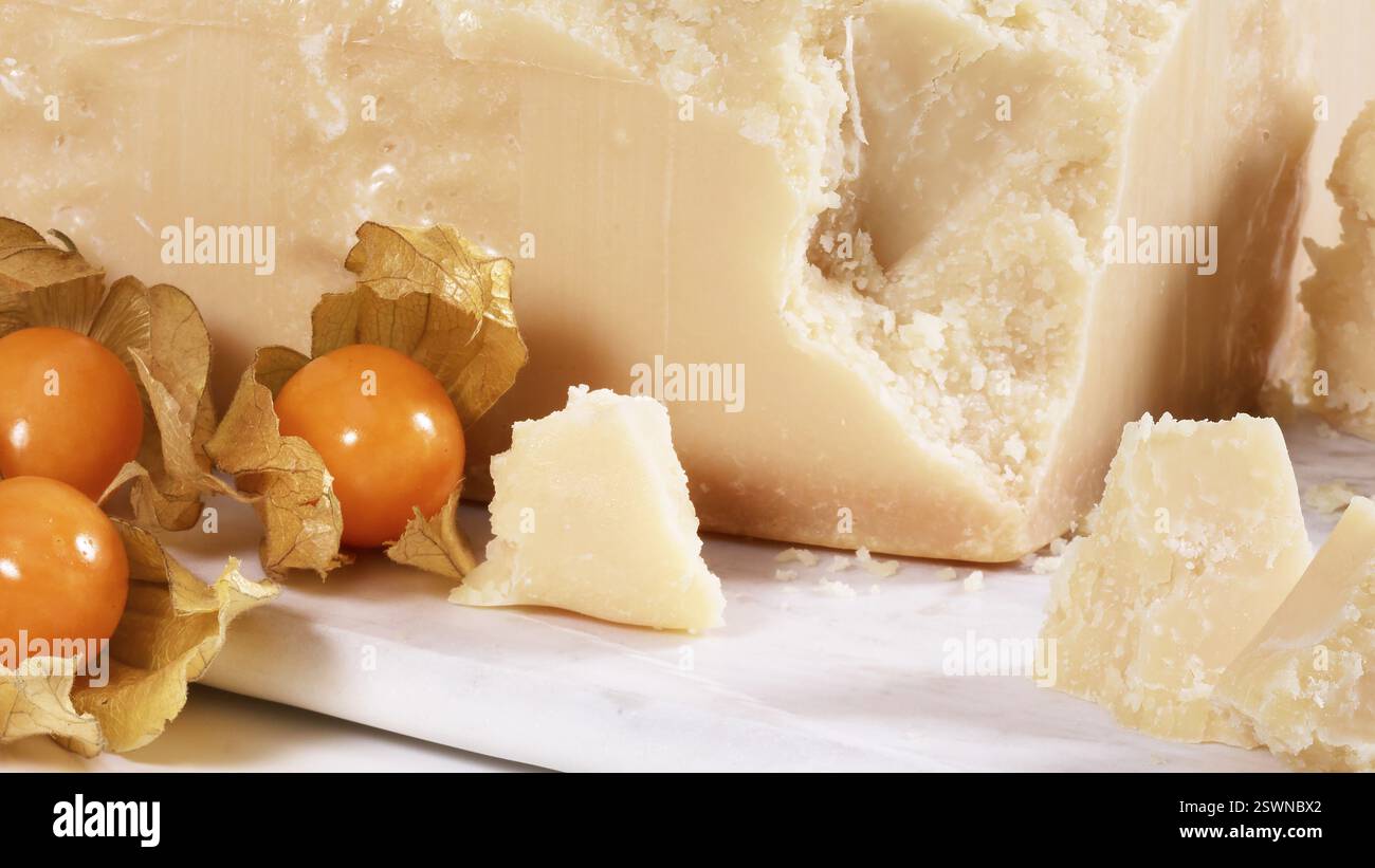 Parmesan, Parmigiano, decorated with Cape gooseberry, physalis, Andean ...