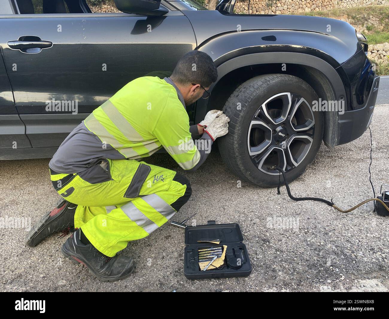 Puncture service, puncture repairer repairs defective tyres, tyre repair kit, compressor, flat ...