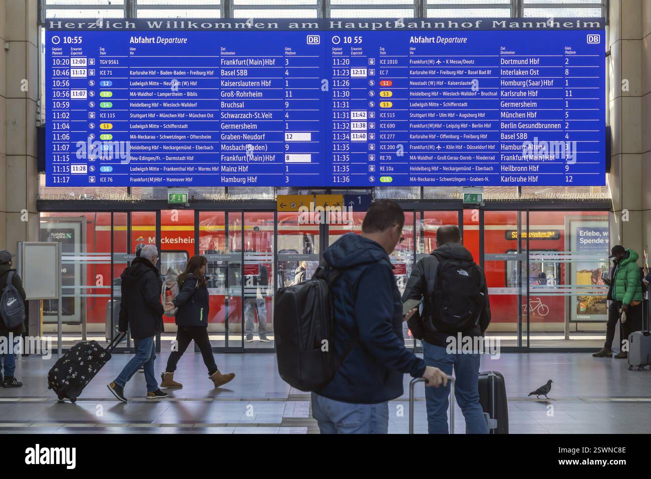 Central station with display board inside the station. Mannheim, Baden-Wuerttemberg, Germany ...