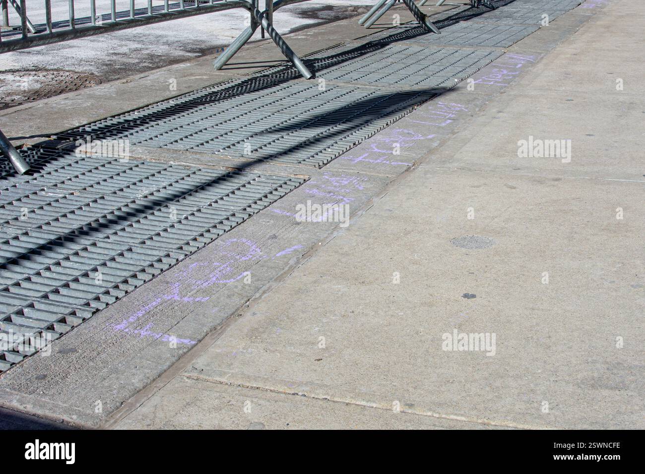 "Free Luigi" can be seen written in chalk on the sidewalk in front of ...
