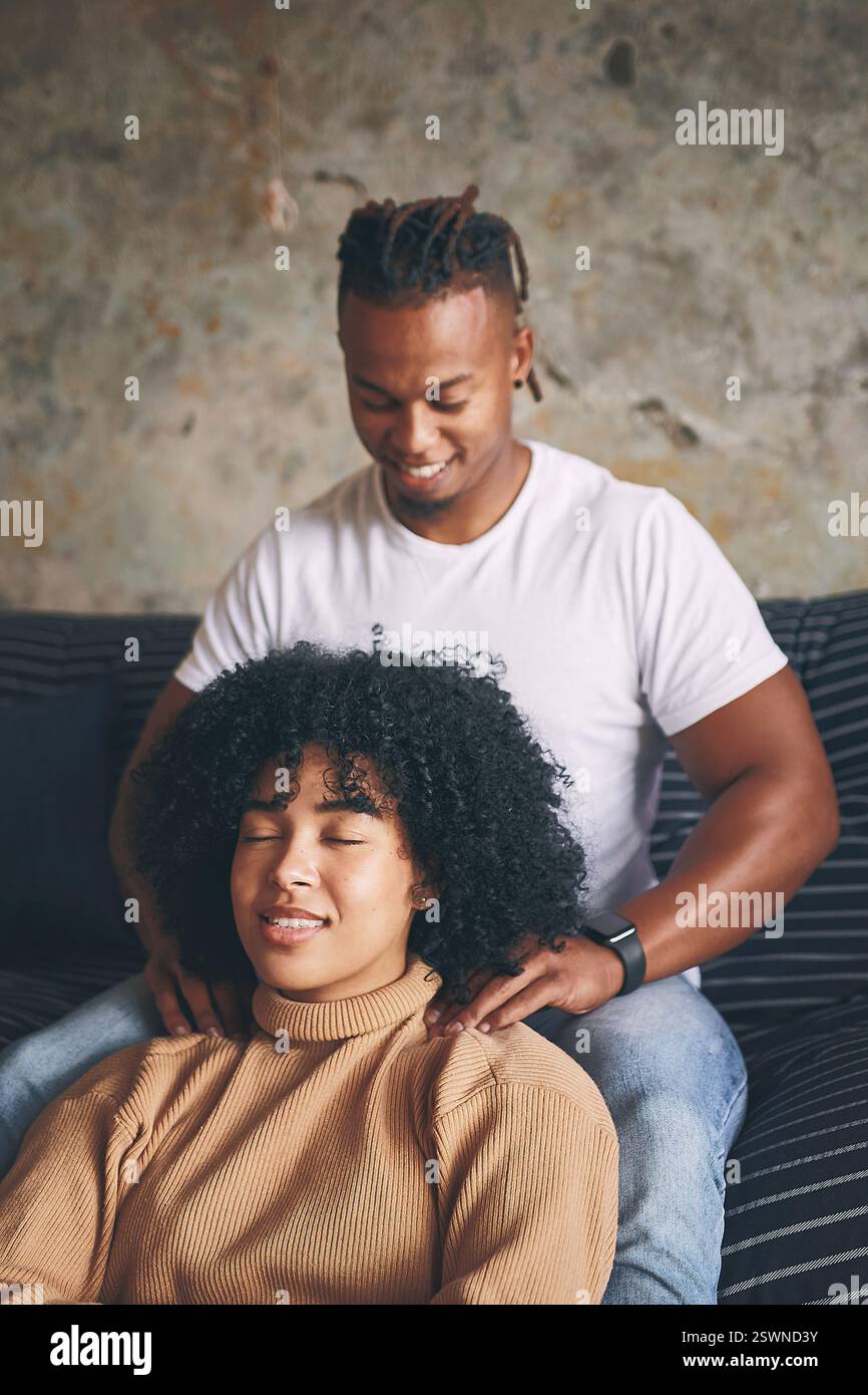 Love, relax and shoulder massage with couple on sofa for bonding ...