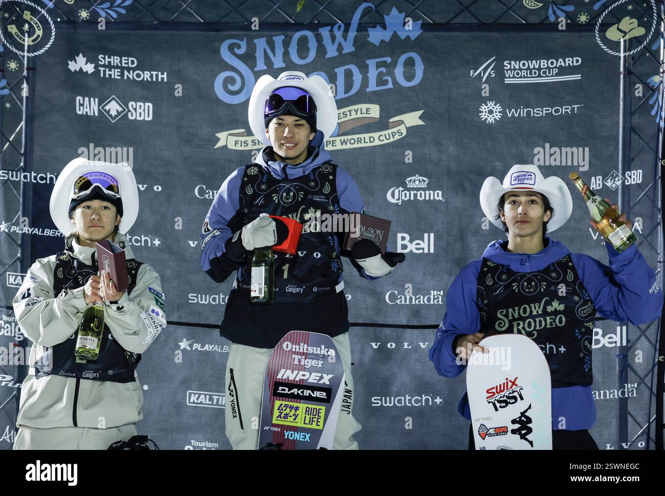 Calgary, Can. 21st Feb, 2025. Japan's Ruka Hirano, centre, celebrates ...
