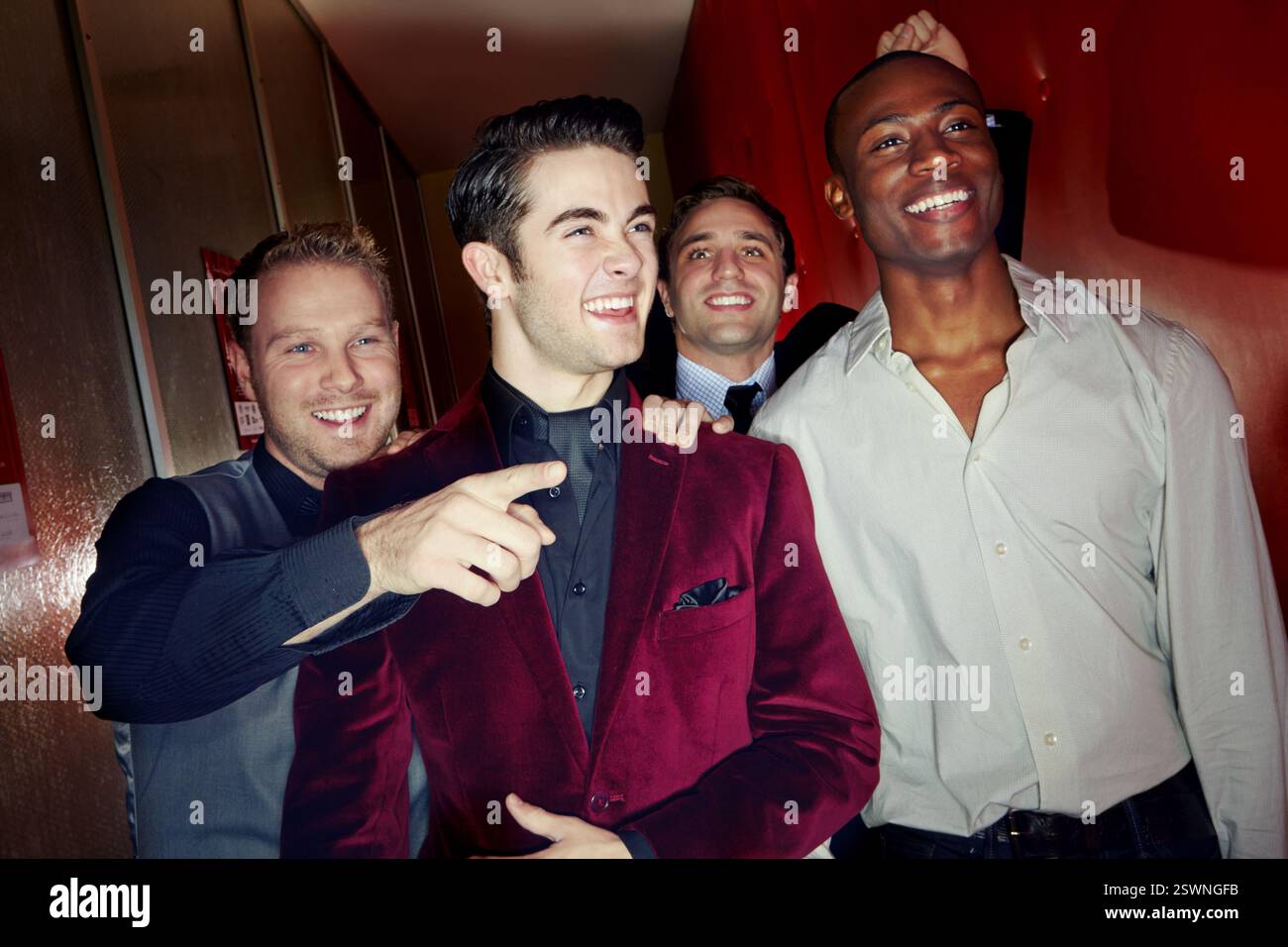 Nightclub, pointing and social with group of friends walking into venue ...