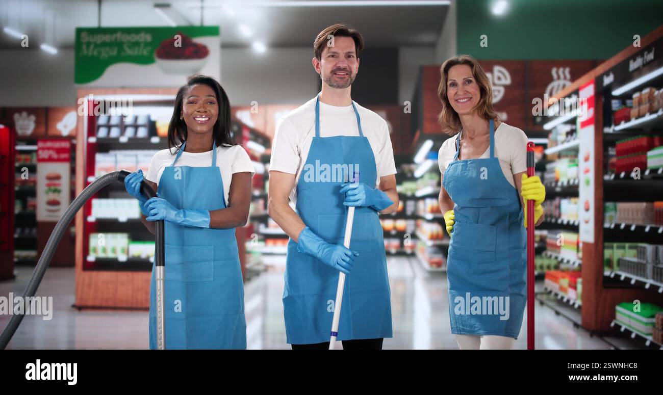 Hardworking janitor cleaning supermarket store for diverse group of ...