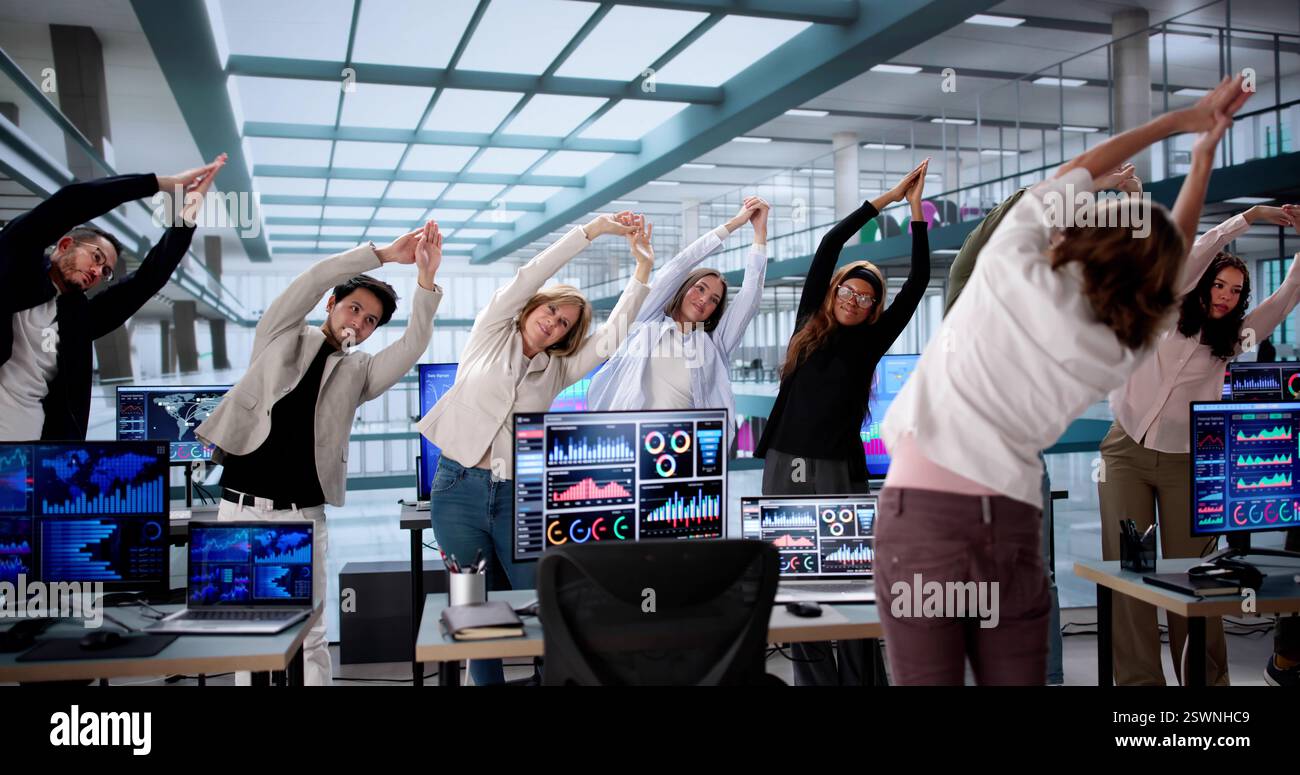 Office workers finding balance with yoga stretch exercise during break ...