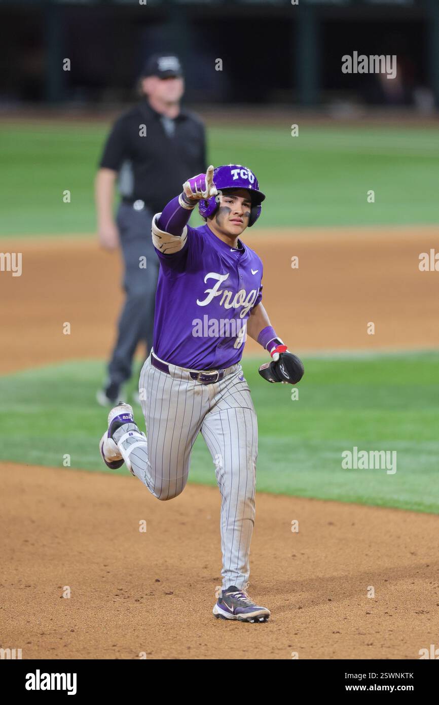 February 21, 2025: Isaac Cadena (8) points towards the dugout as he ...