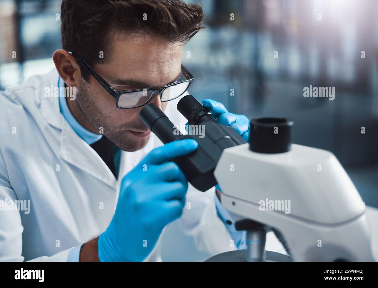 Science, man and microscope in lab for development, pharma experiment ...