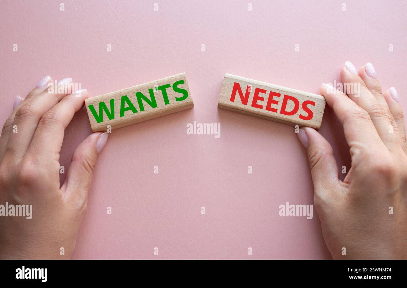 Wants and Needs symbol. Concept word Wants and Needs on wooden blocks ...