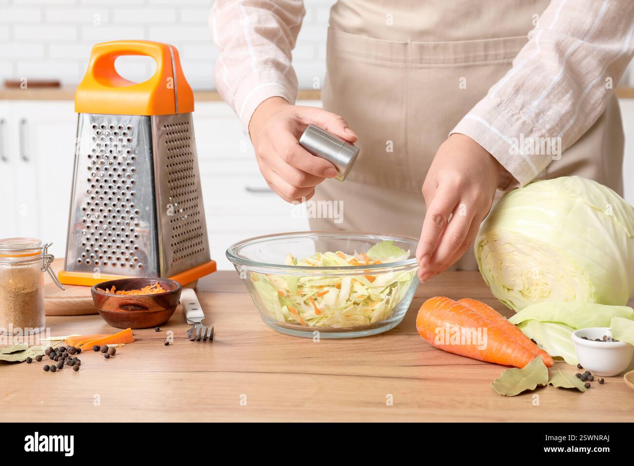 Woman salting tasty salad hi-res stock photography and images - Alamy