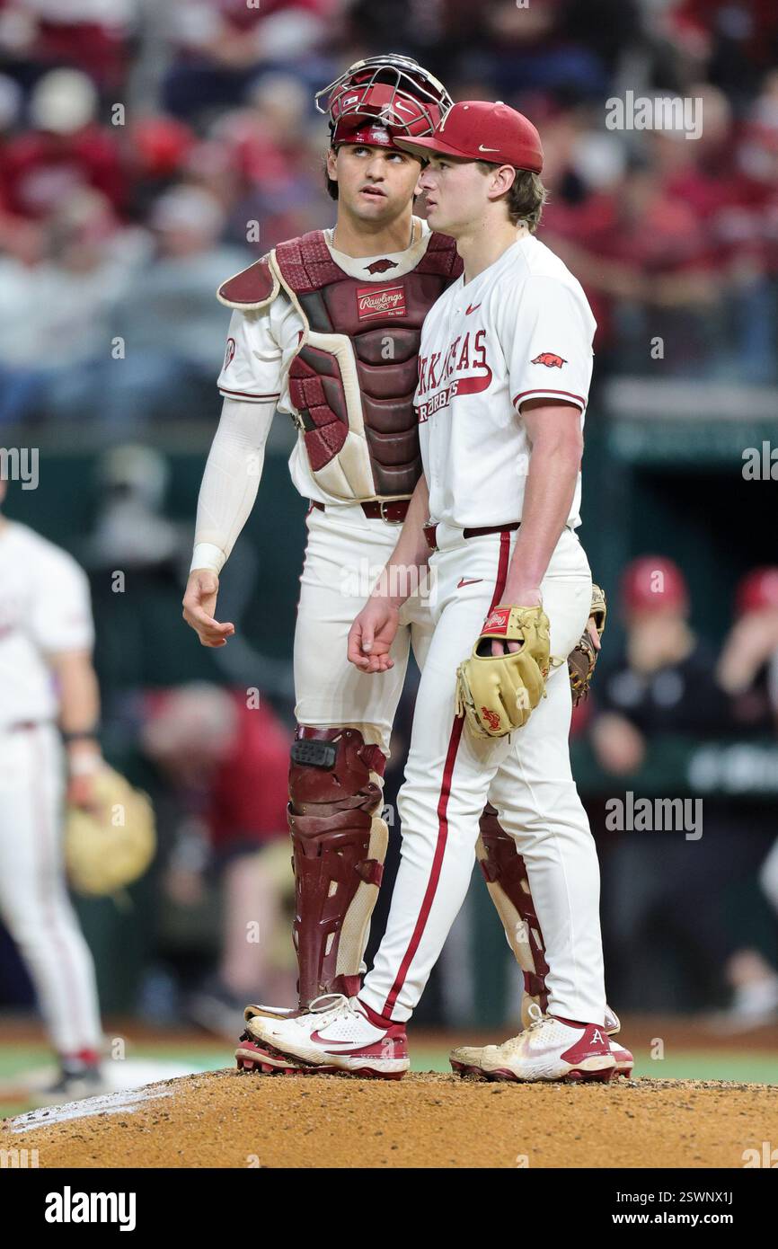 February 21, 2025: Hogs catcher Ryder Helfrick (27) has a conversation ...