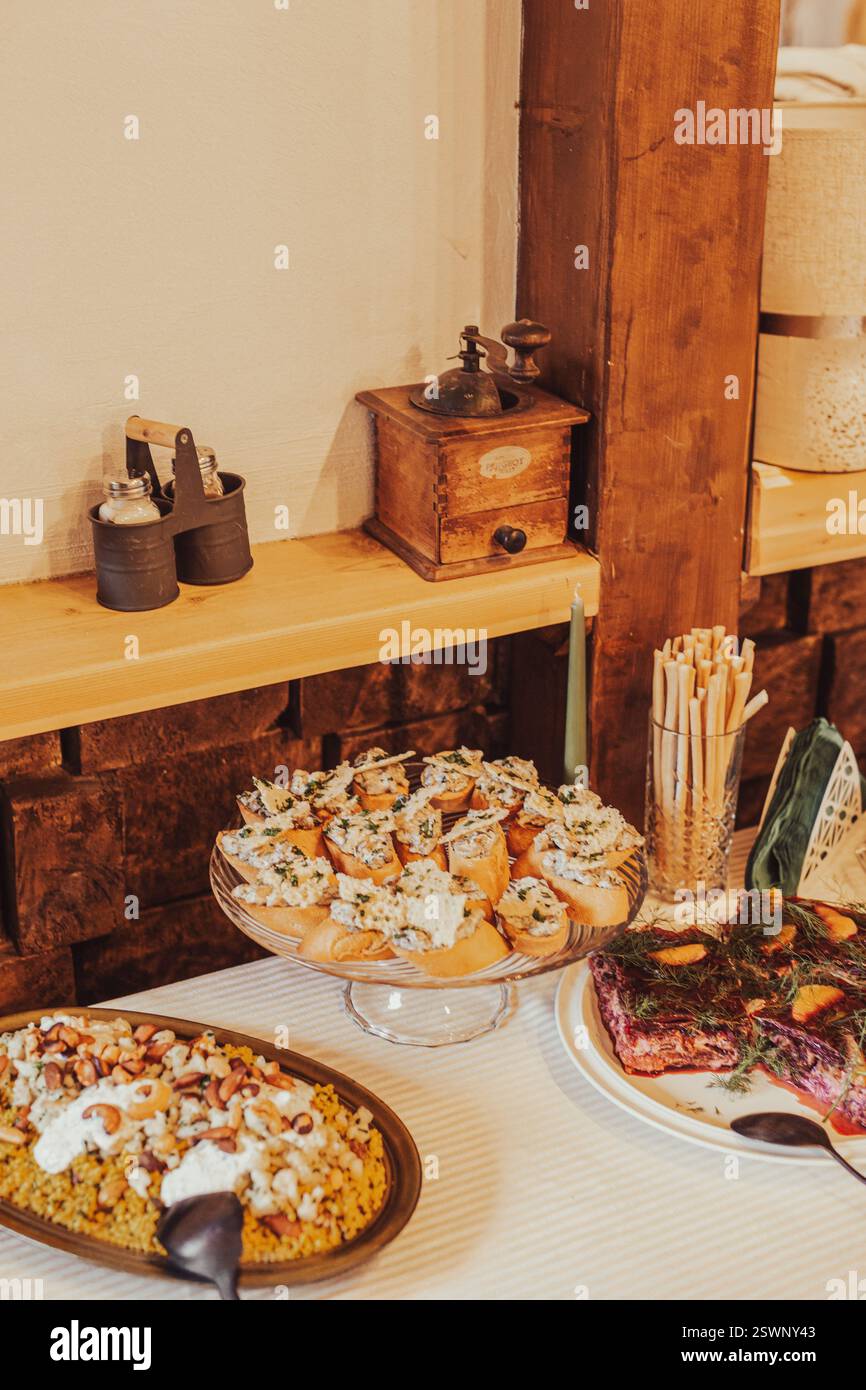 Rustic buffet display featuring various delicious appetizers and food ...