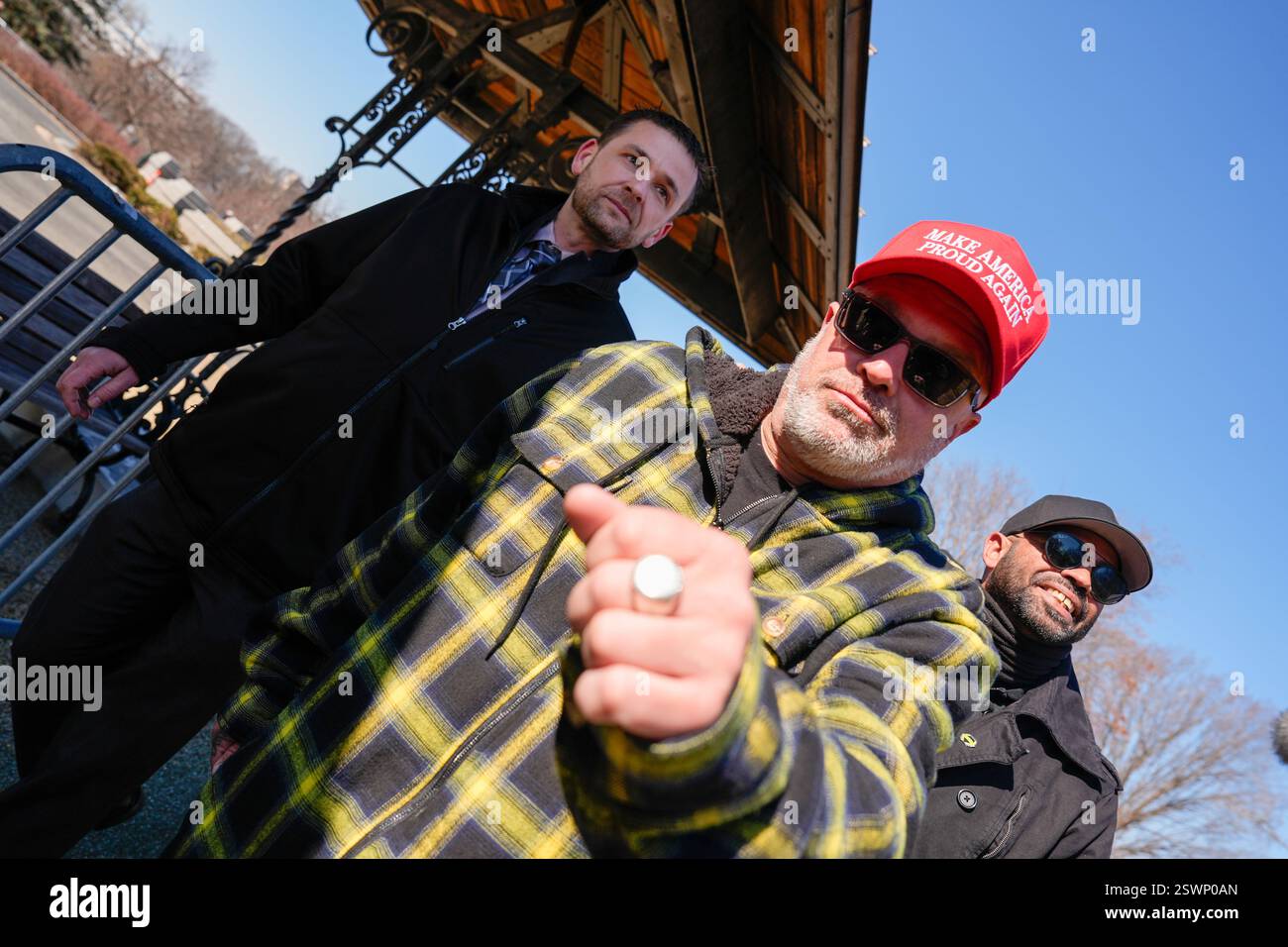 Washington, United States. 21st Feb, 2025. Joe Biggs (center) gestures ...