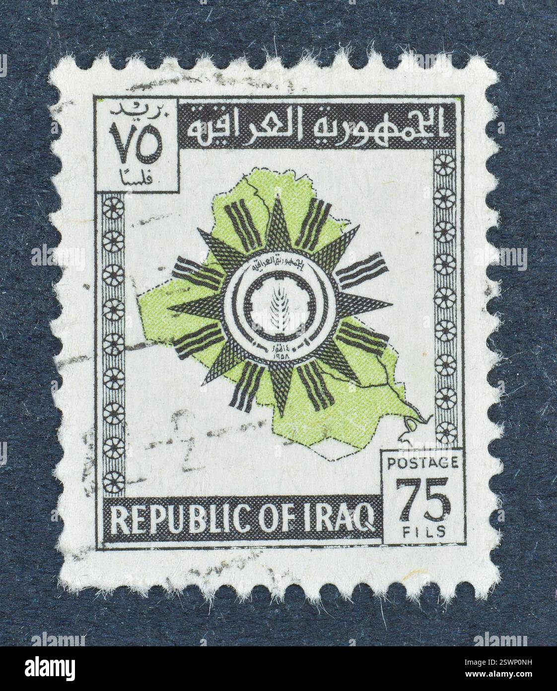 Cancelled postage stamp printed by Iraq, that shows Map and coat of ...