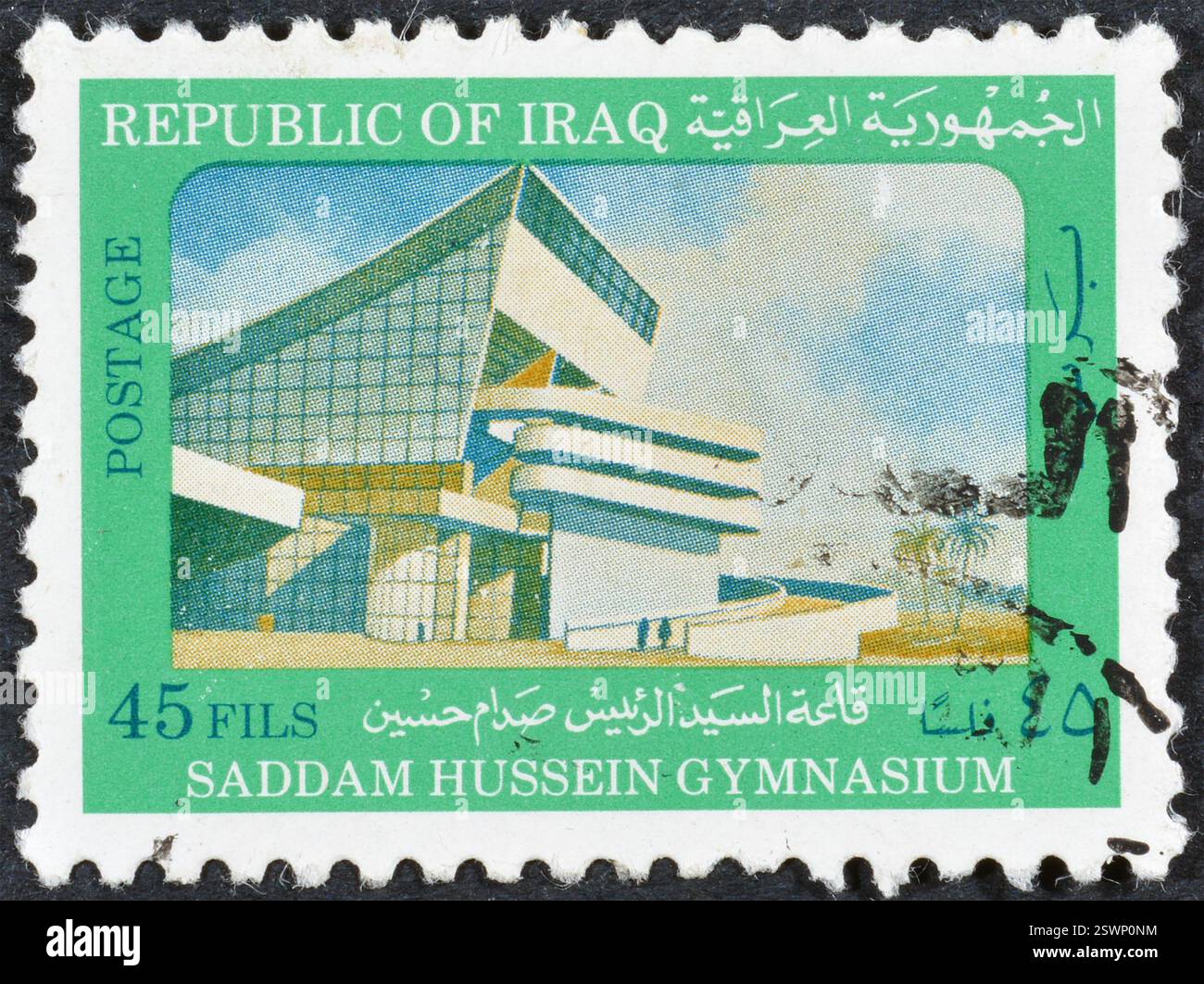 Cancelled postage stamp printed by Iraq, that shows Saddam Hussein ...