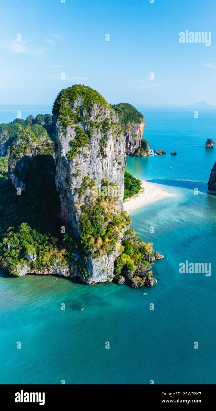 Breathtaking limestone cliffs rise majestically above crystal-clear ...