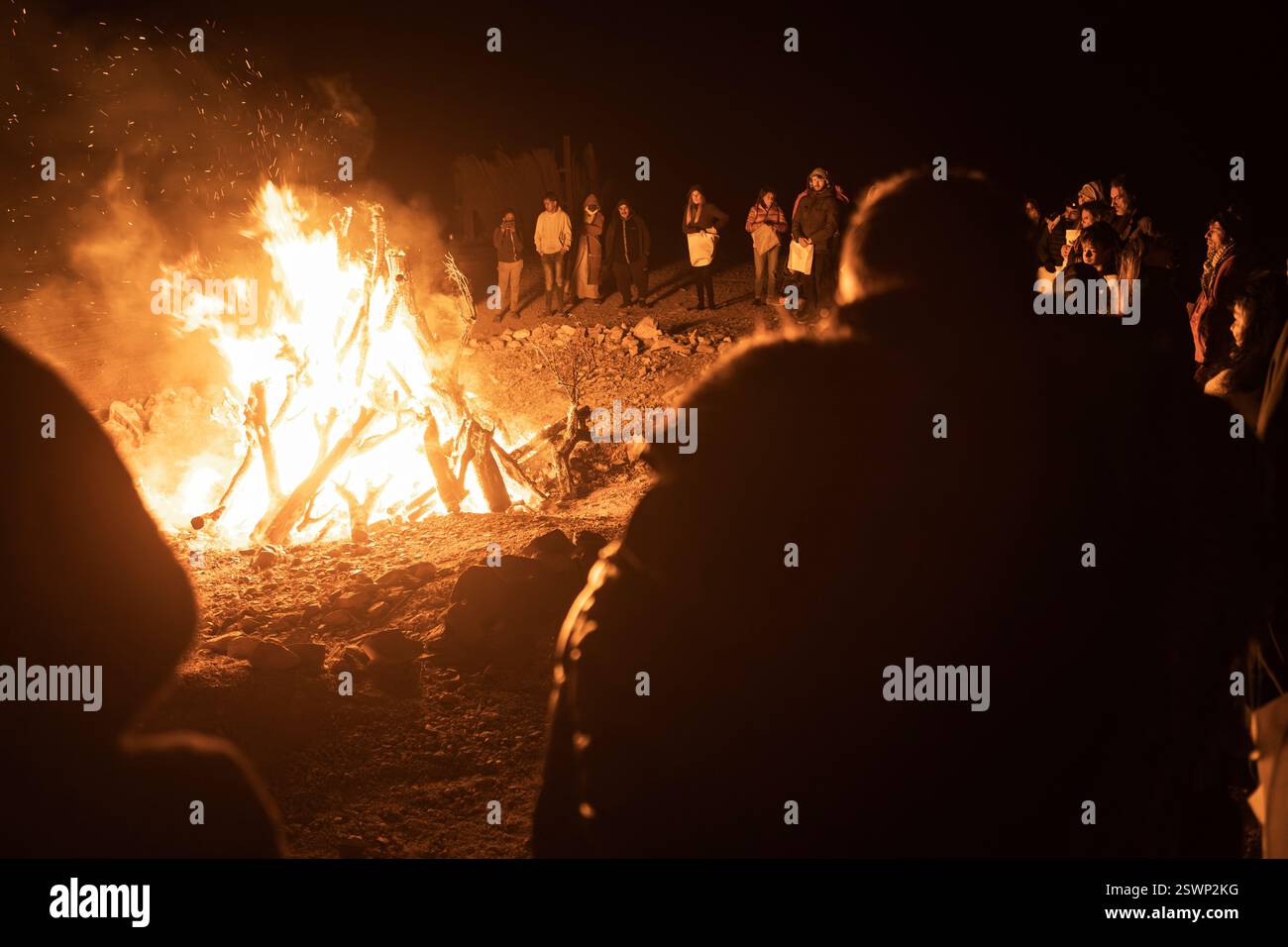 Tourists are enjoying a bonfire in the marsa alam desert at night ...