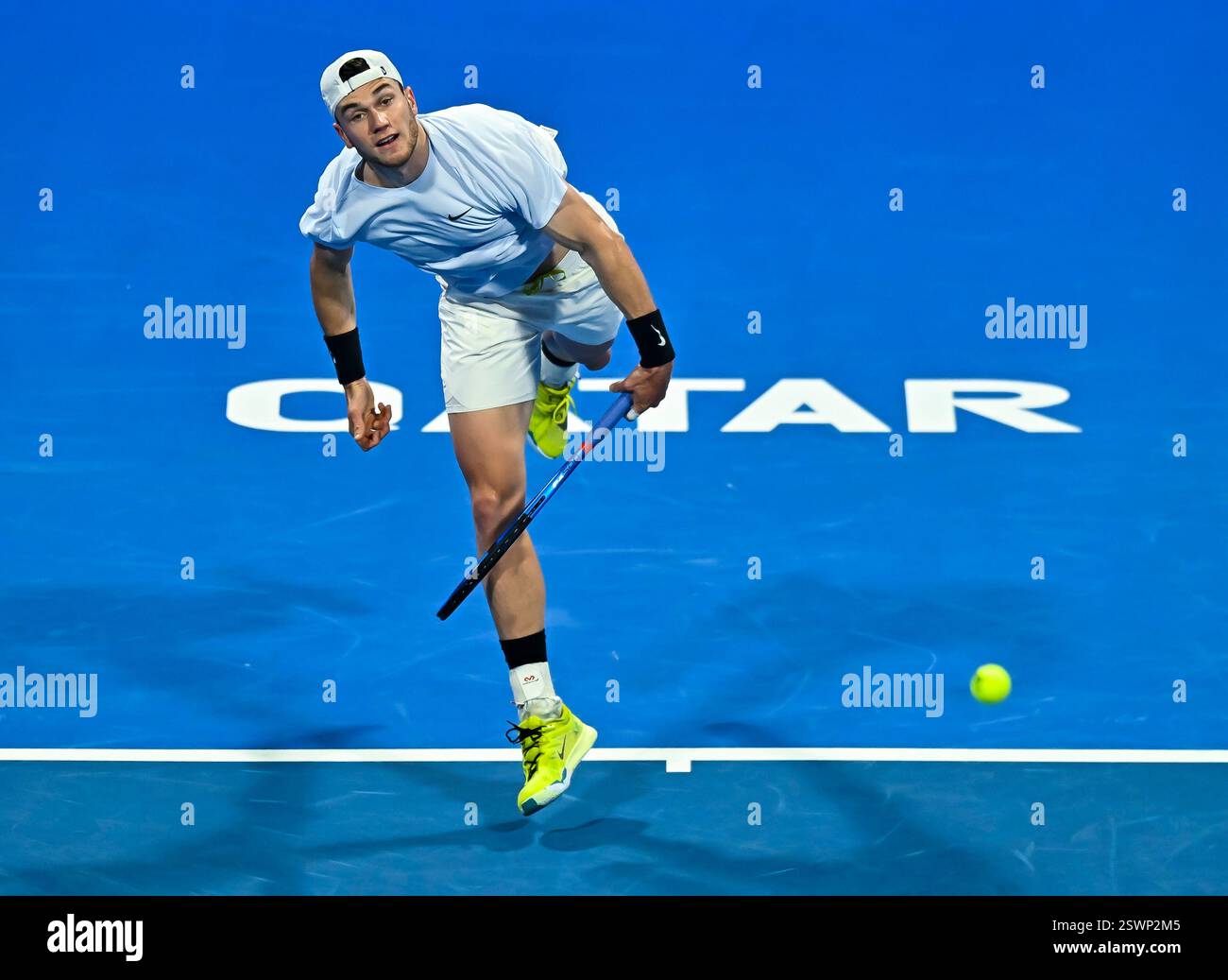 Doha, Qatar. 21st Feb, 2025. Jack Draper of Britain hits a return ...