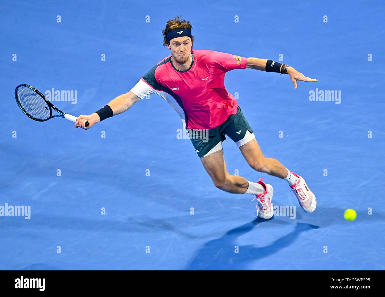 Doha, Qatar. 21st Feb, 2025. Andrey Rublev of Russia hits a return during the men's singles ...
