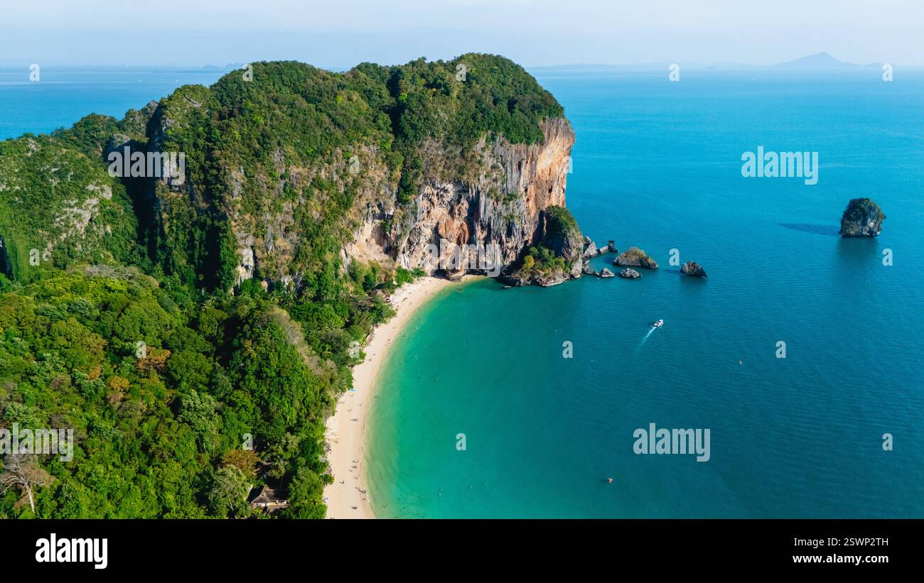 Soft golden sands meet crystal clear waters at Railay Beach, Krabi ...