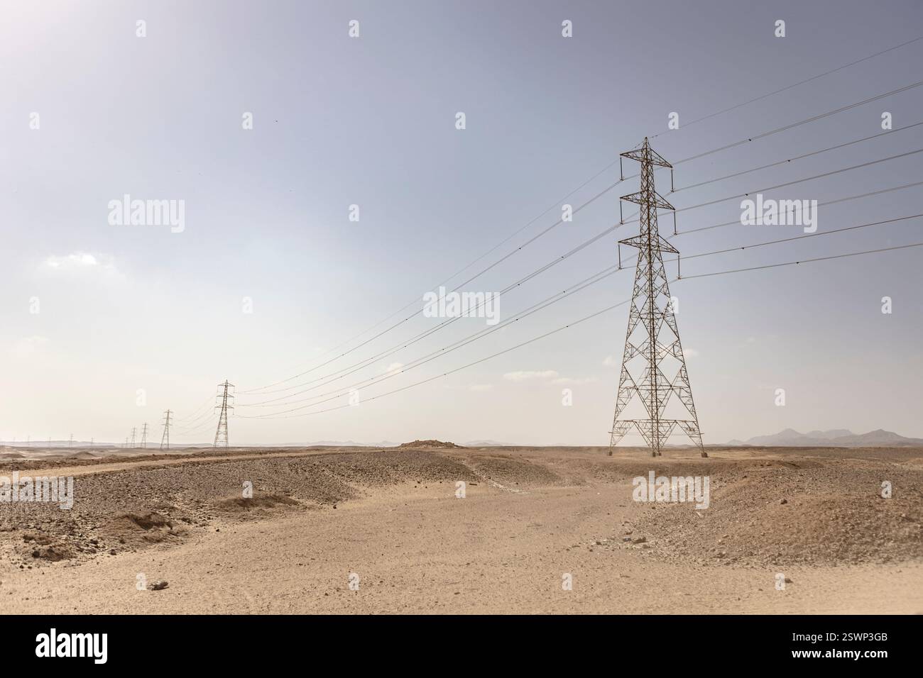 Electricity pylons transporting energy across the arid landscape of ...
