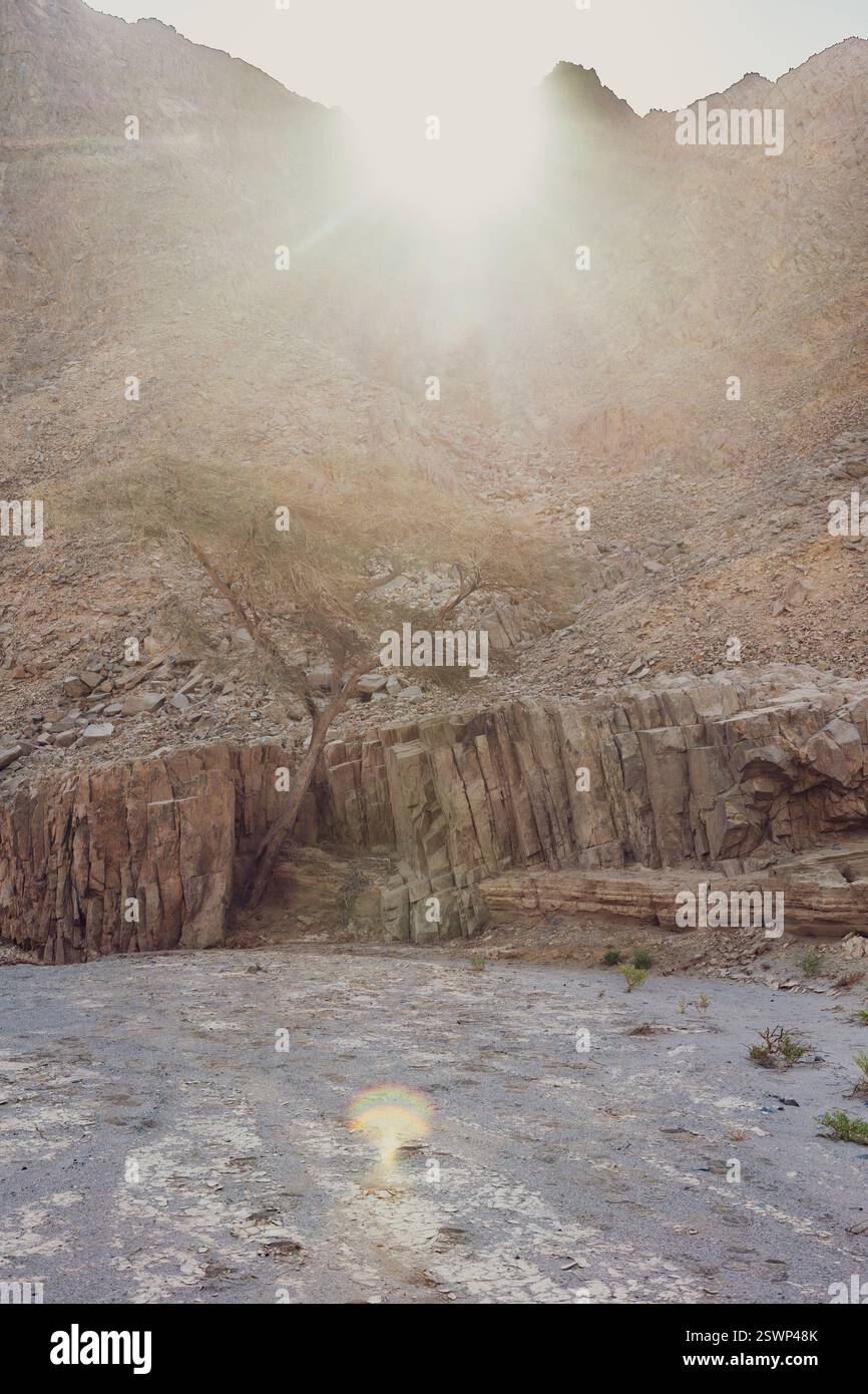 Sunlight beams over rocky cliffs in marsa alam, egypt, highlighting a ...