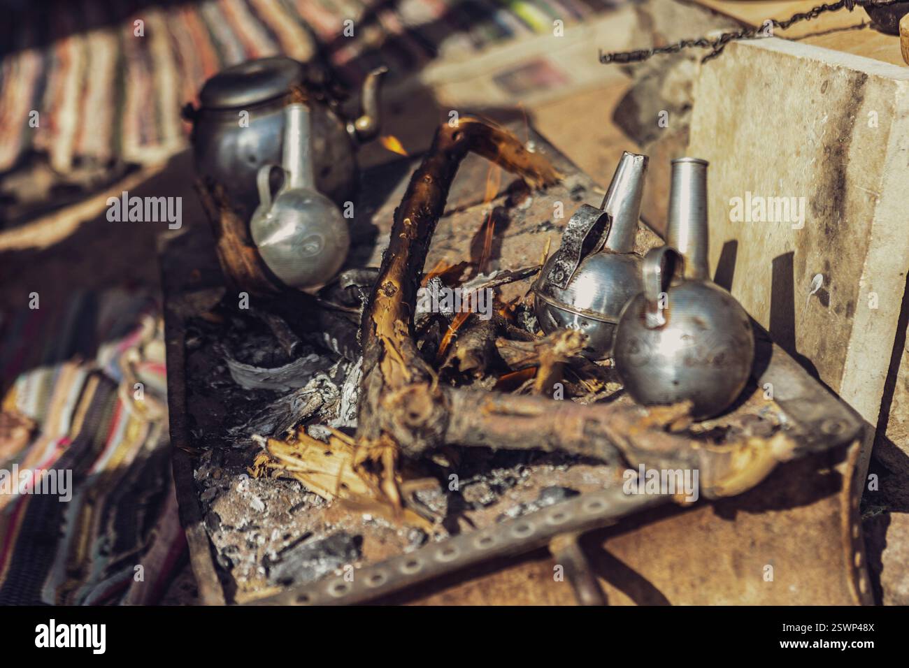 Rustic tea brewing setup in marsa alam desert, featuring traditional ...