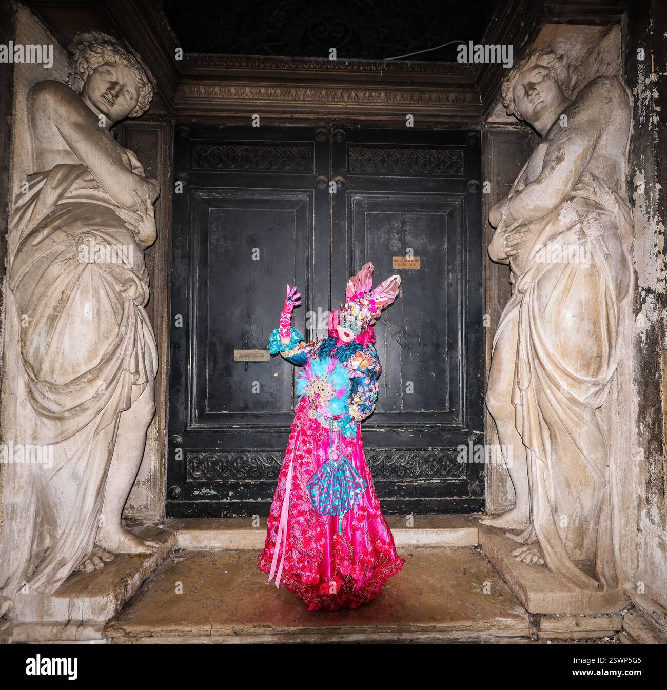 venice, Italy. 22nd Feb, 2025. Revellers by San Marks in colourful ...