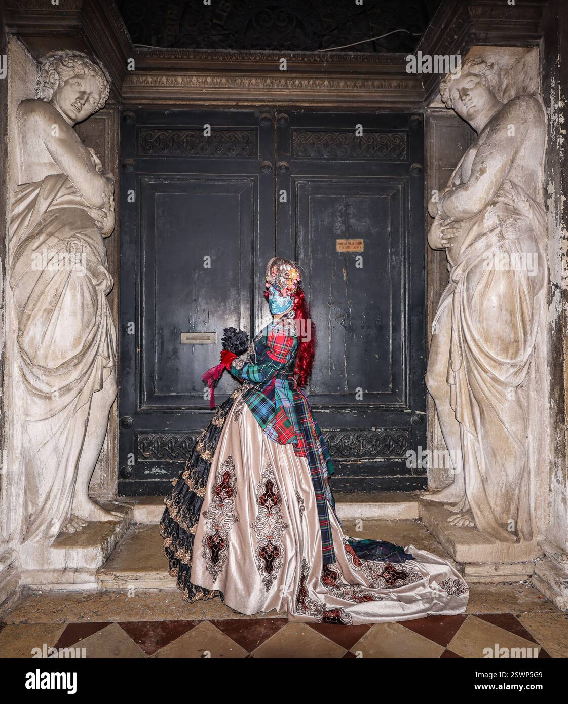 venice, Italy. 22nd Feb, 2025. Revellers by San Marks in colourful ...