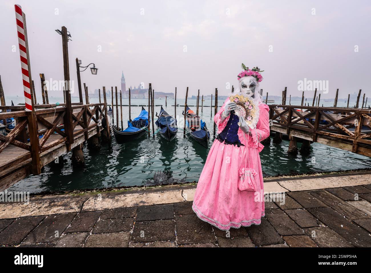 venice, Italy. 22nd Feb, 2025. Revellers by San Marks in colourful ...