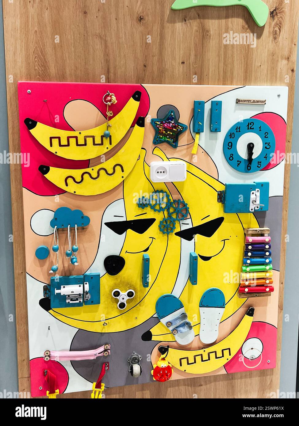 Interactive busy board featuring engaging activities for kids to ...