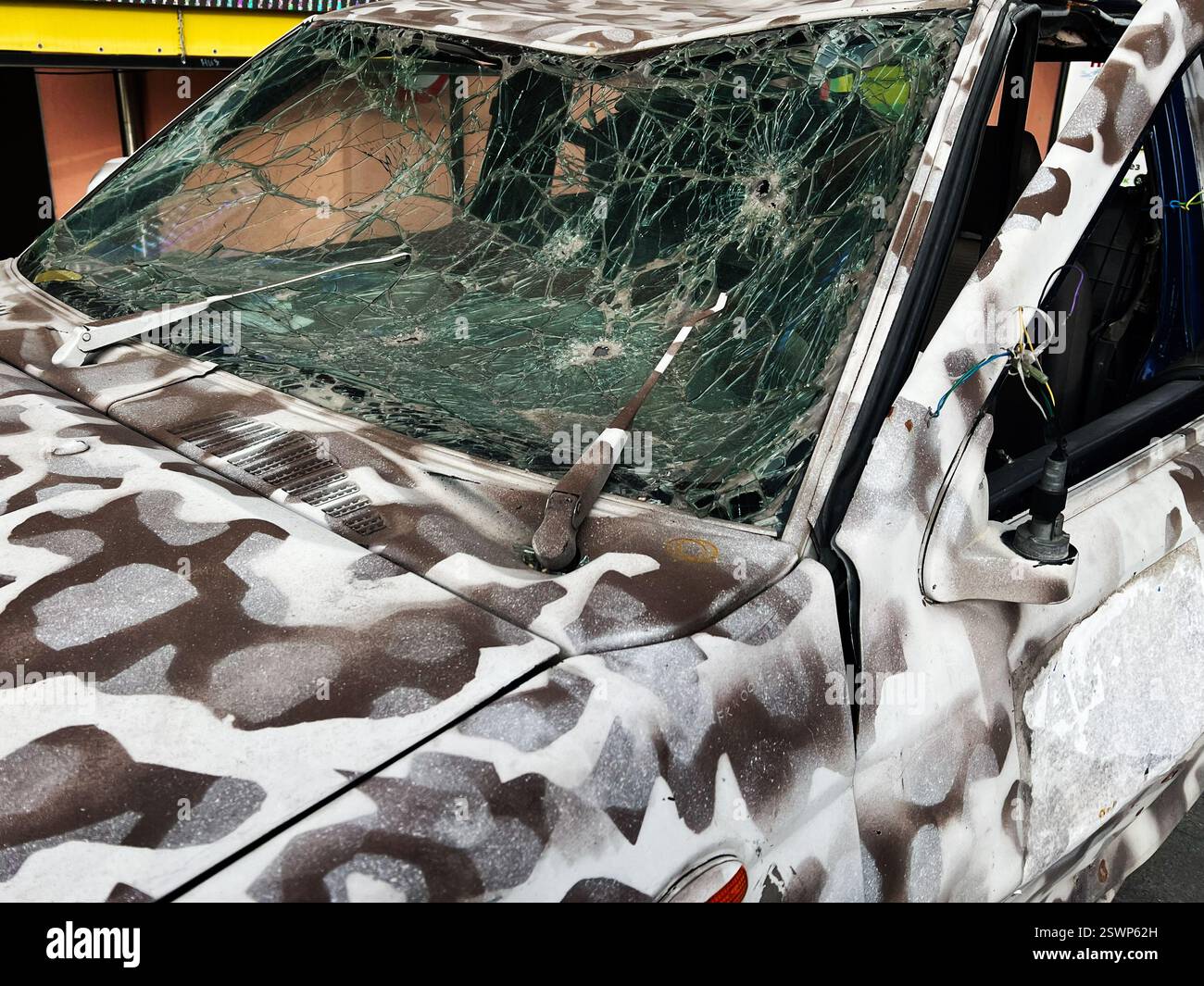 Shattered military vehicle windshield and damaged exterior with ...