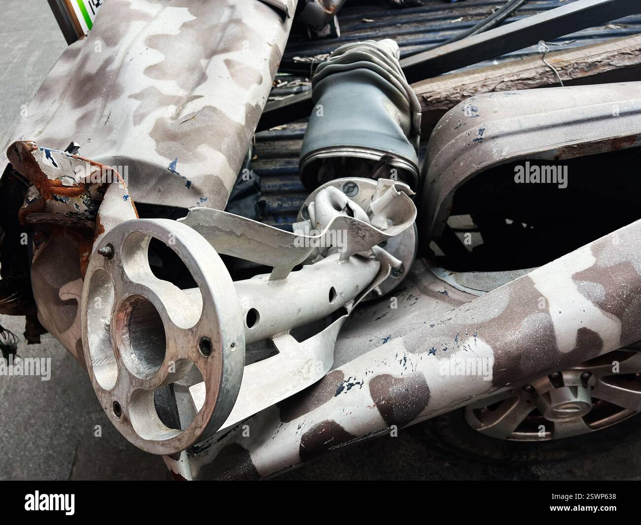Close-up of various broken metallic parts damaged, showing details and ...
