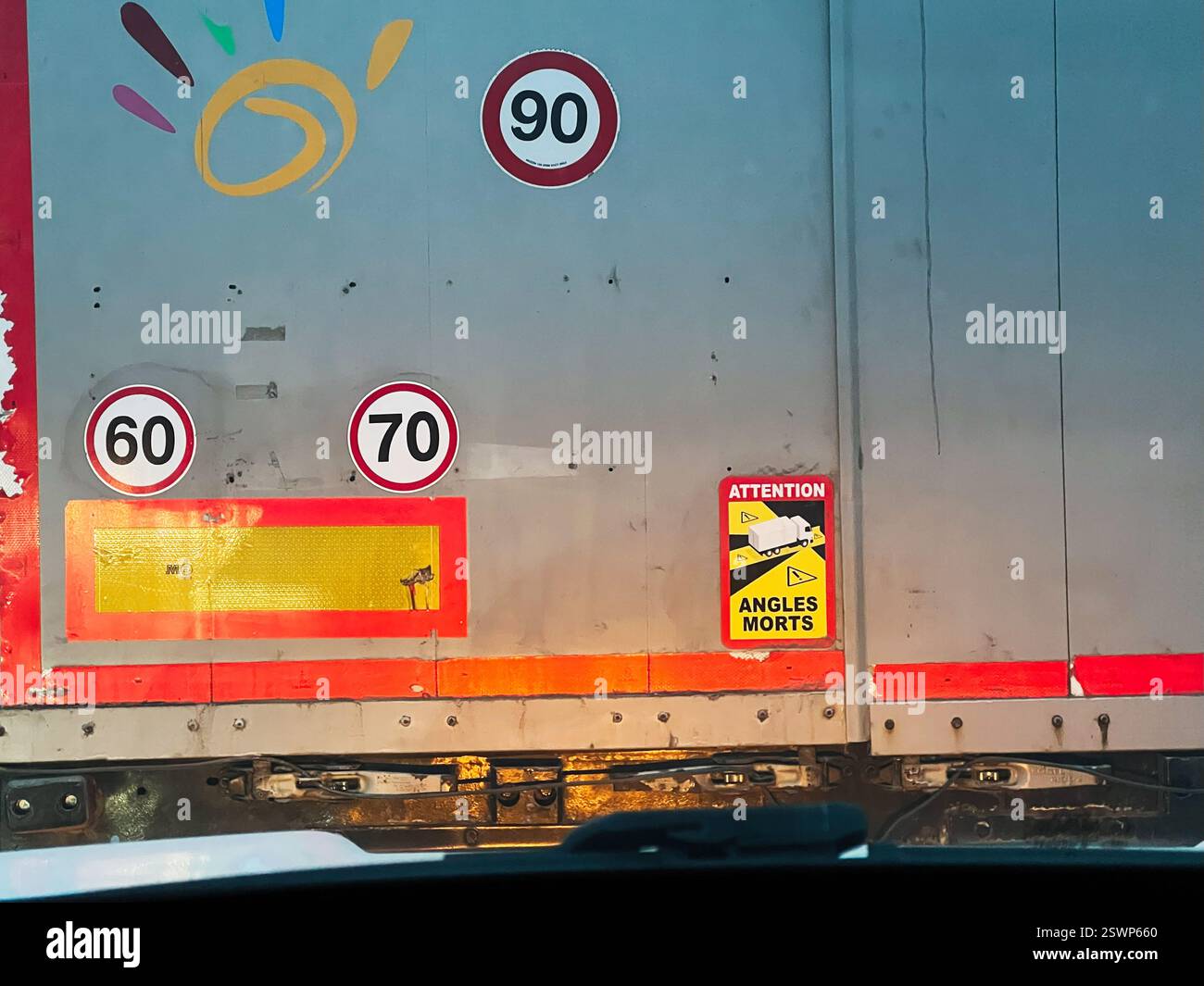 Close-up of safety markings on a truck displaying warning signs and ...