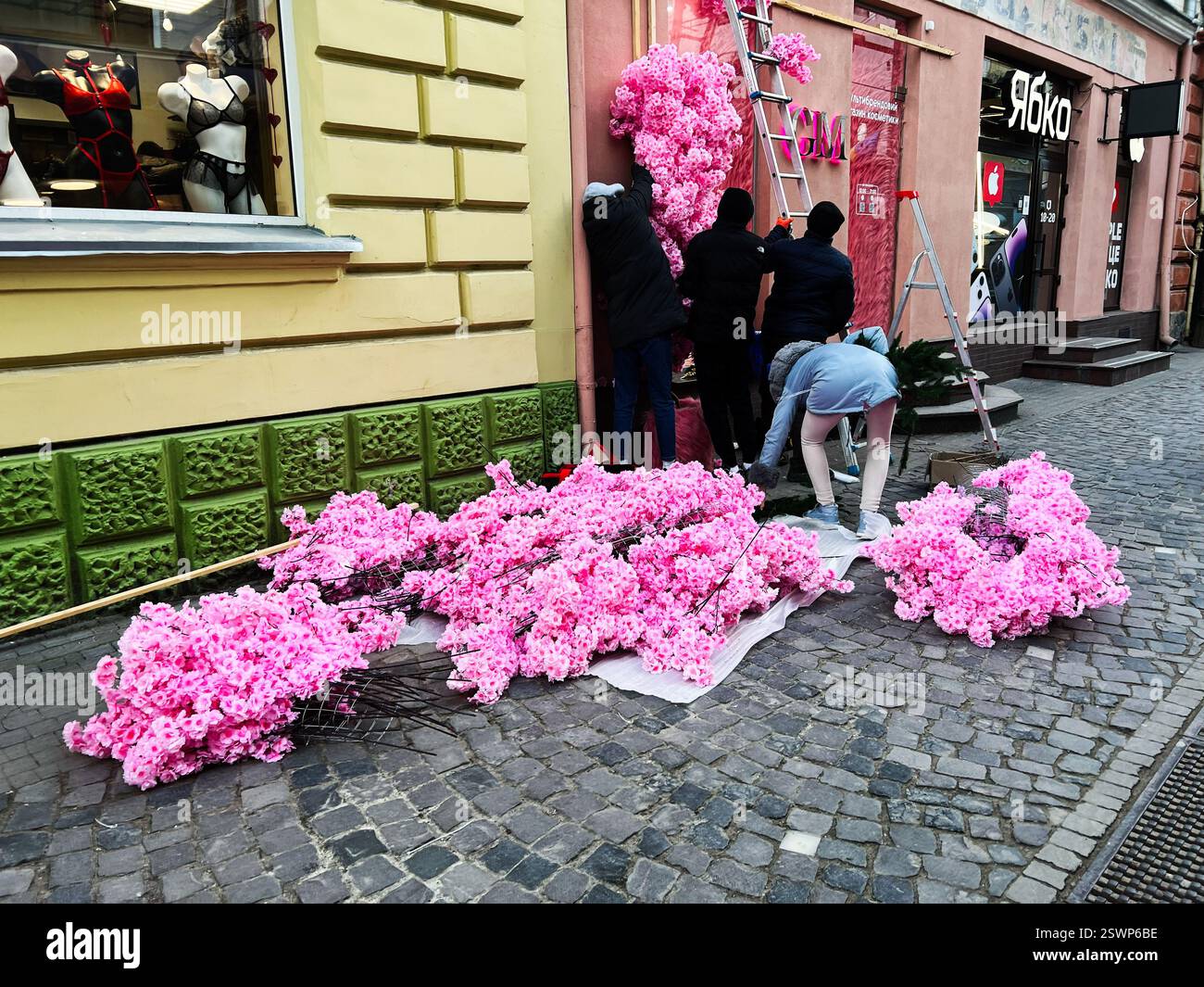 Kyiv, Ukraine - February 16, 2025: A team works together installing a ...