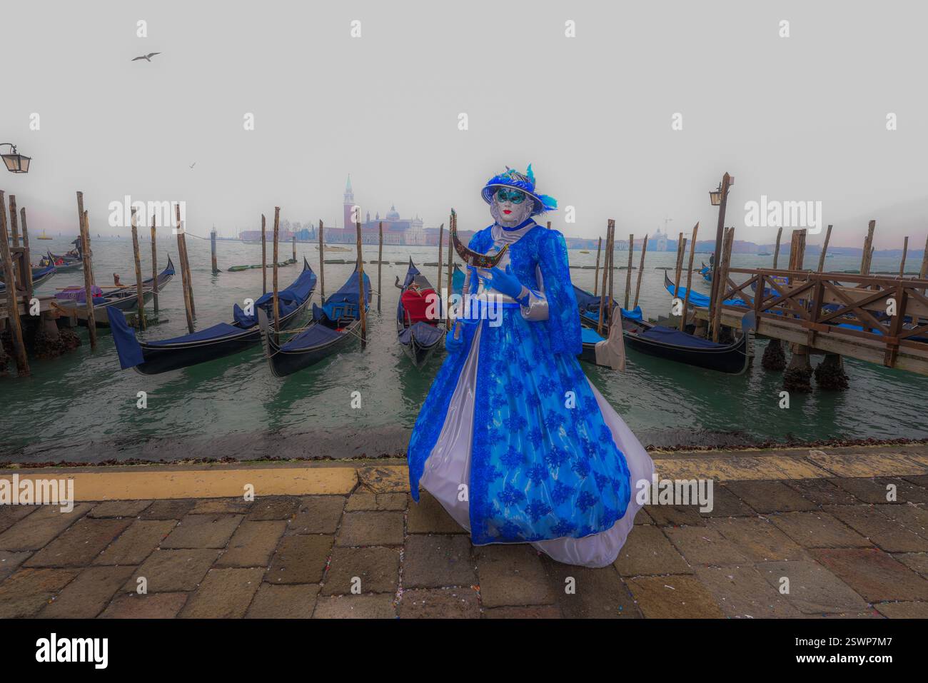 venice, Italy. 22nd Feb, 2025. Revellers by San Marks in colourful ...