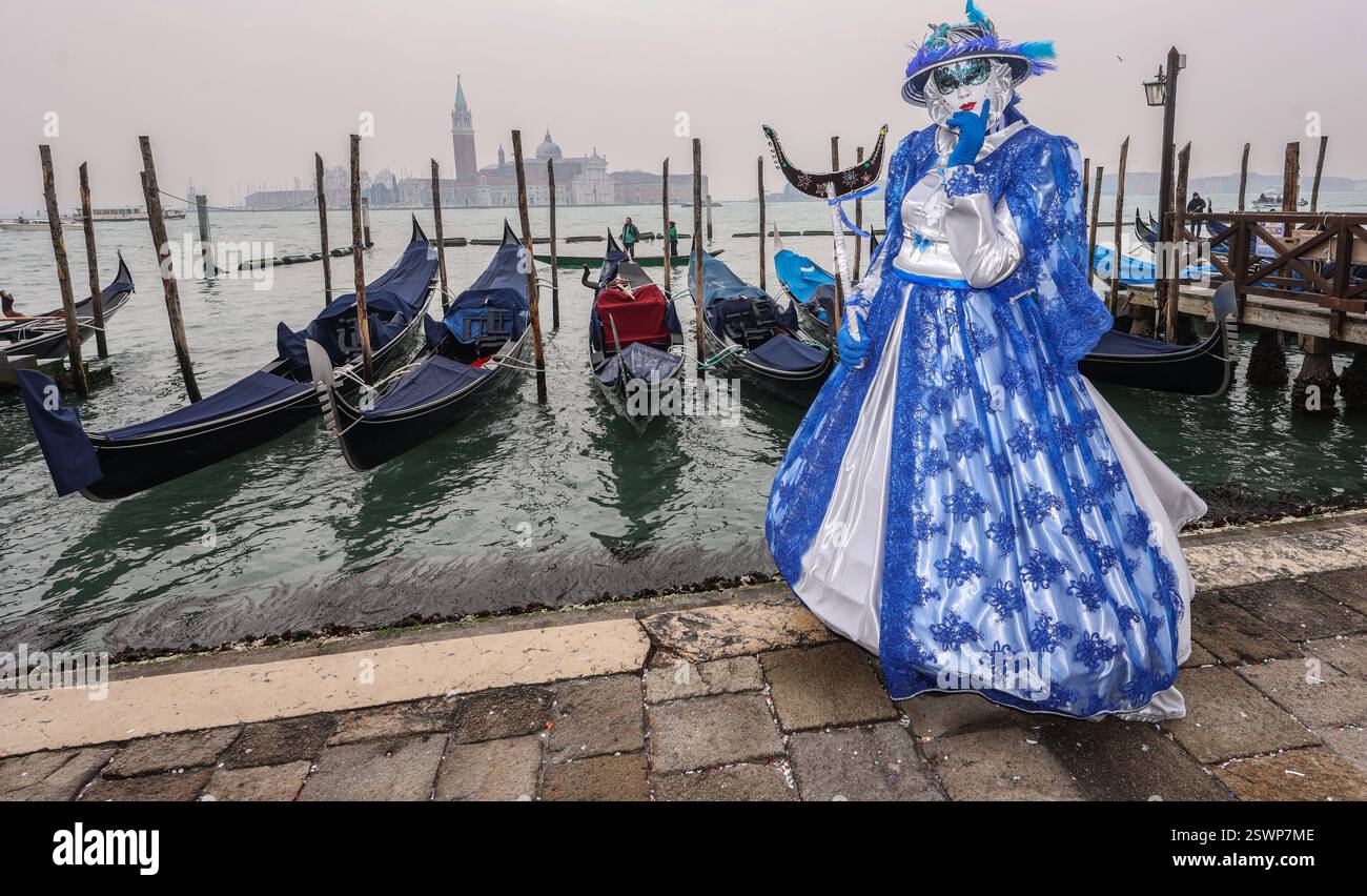 venice, Italy. 22nd Feb, 2025. Revellers by San Marks in colourful ...