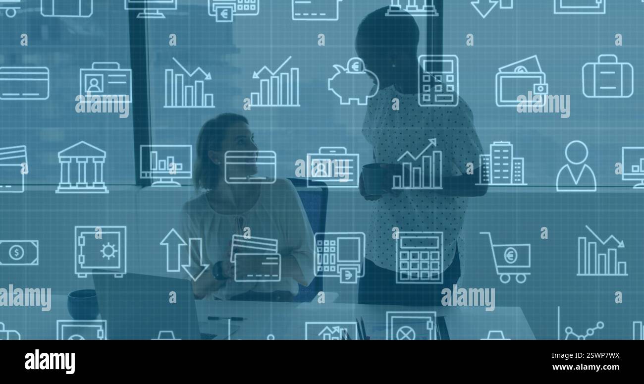 Business icons and data analytics image over two colleagues discussing in office Stock Photo - Alamy