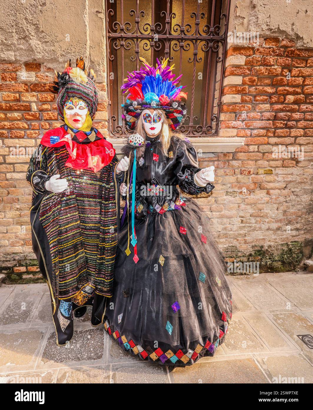 venice, Italy. 22nd Feb, 2025. Revellers by San Marks in colourful ...