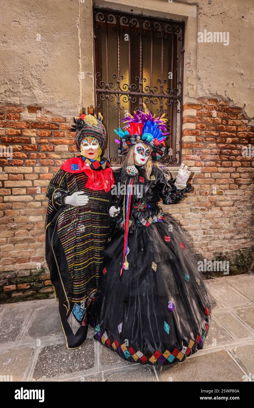 venice, Italy. 22nd Feb, 2025. Revellers by San Marks in colourful ...